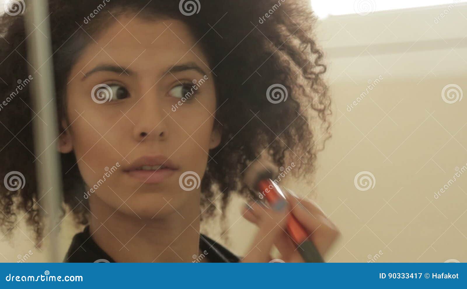 Model with a Frizzy Afro Hairstyle Putting Makeup Stock Video - Video ...