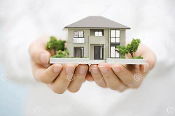 Model House with a Hand stock photo. Image of material - 10152456