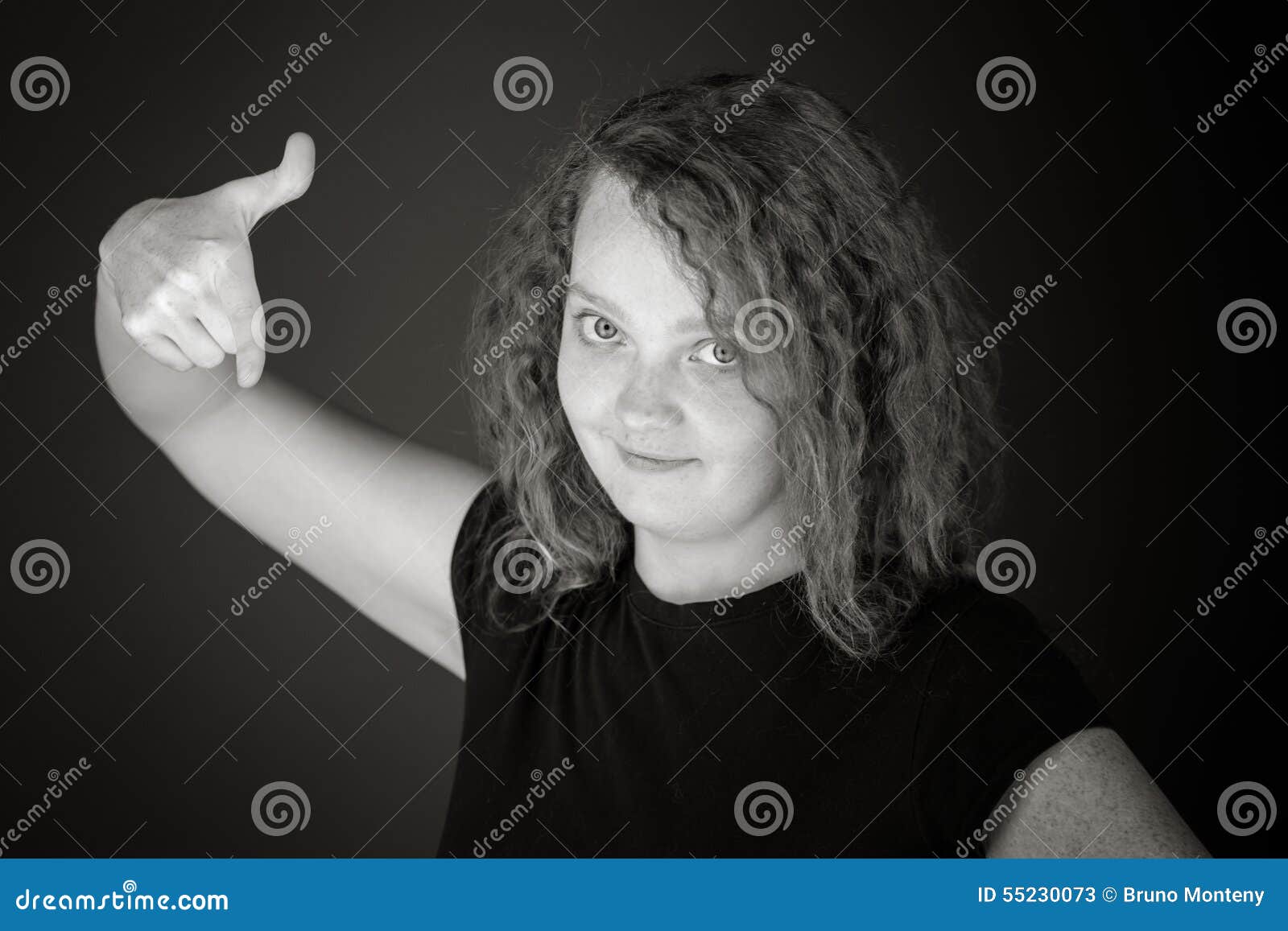Model Isolated on Plain Background Pointing To Stock Image - Image of ...