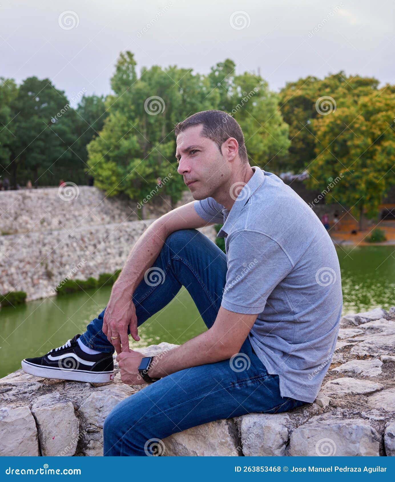 A Model in Jeans Posing Relaxed Stock Photo - Image of taking, lake ...