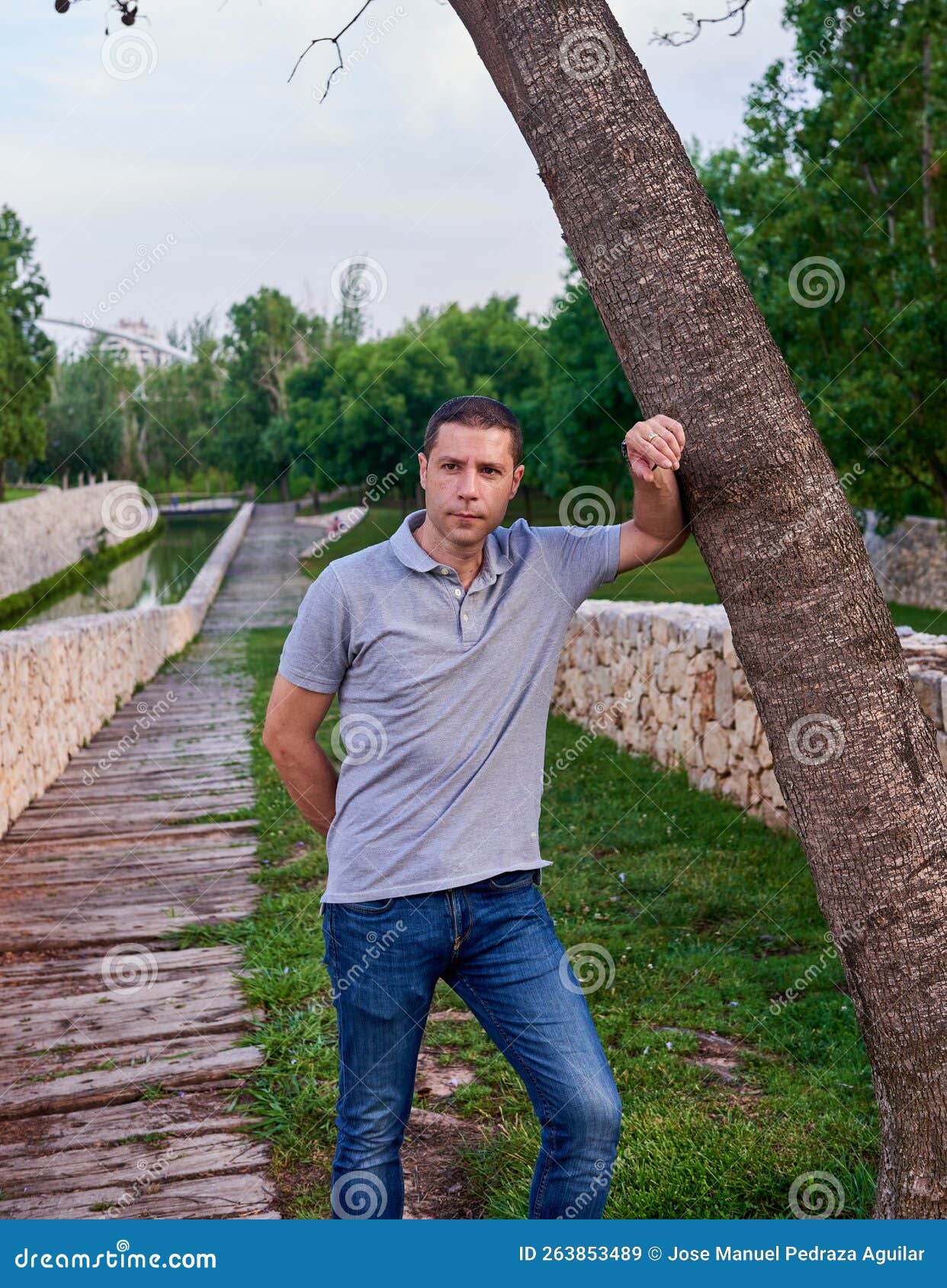 A Model Leaning on a Tree in a Park Stock Image - Image of vacation ...