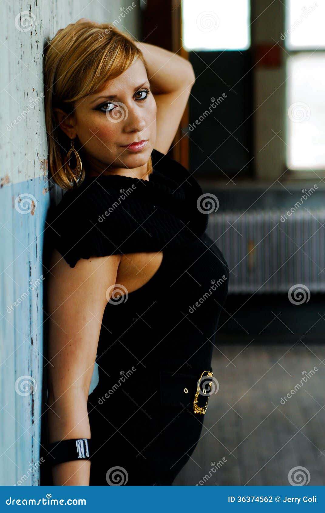 Model Leaning on a wall. stock photo. Image of suspenders - 36374562