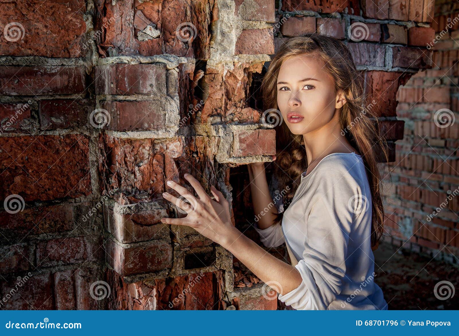 Model near the brick wall stock photo. Image of district - 68701796