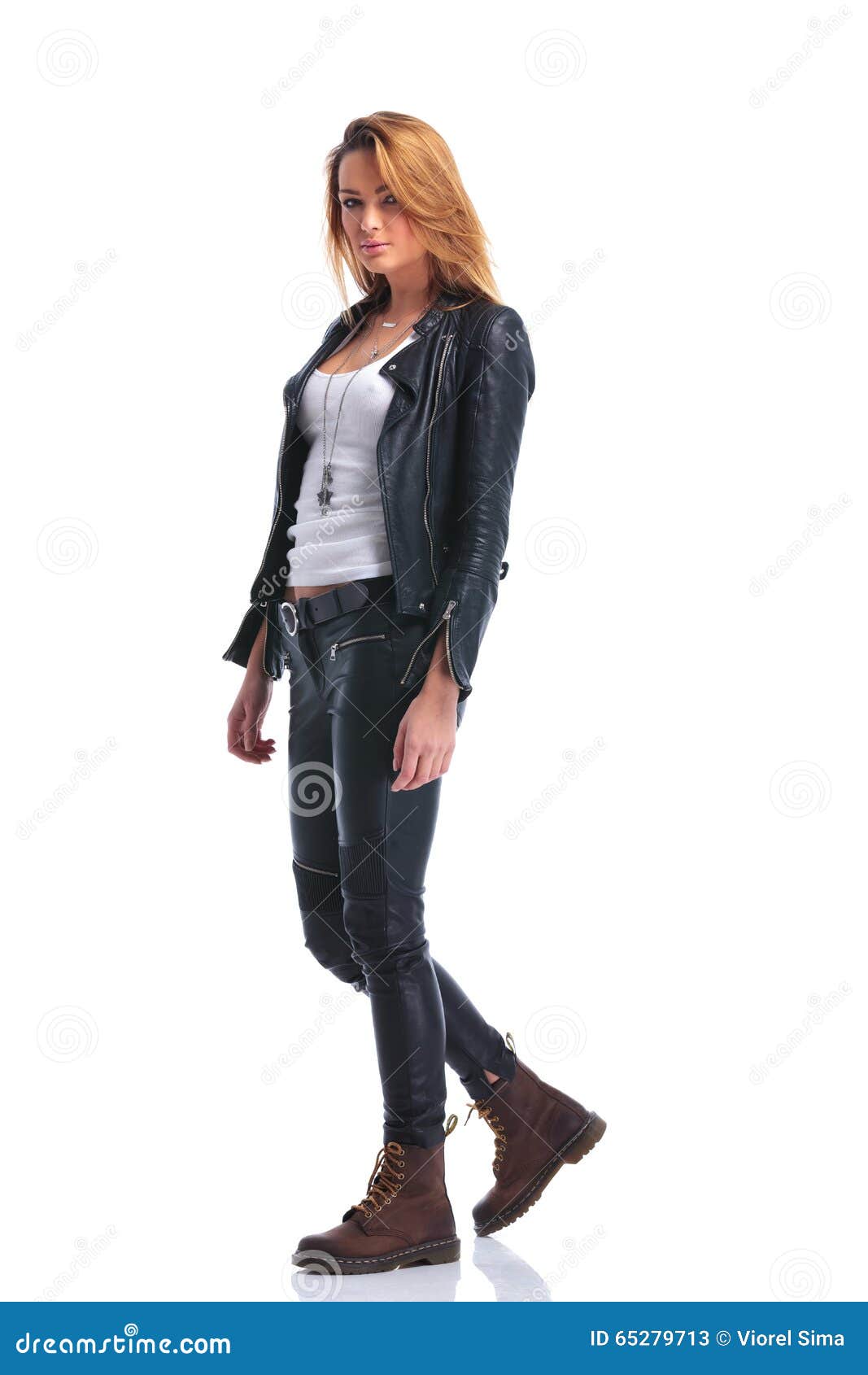 Model Pose in Leather Jacket while Walking in Studio and Looking Stock ...