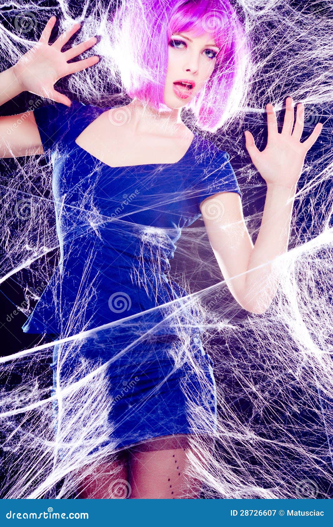 Model with Purple Wig and Intense Make-up Trapped in a Spider Web Stock ...
