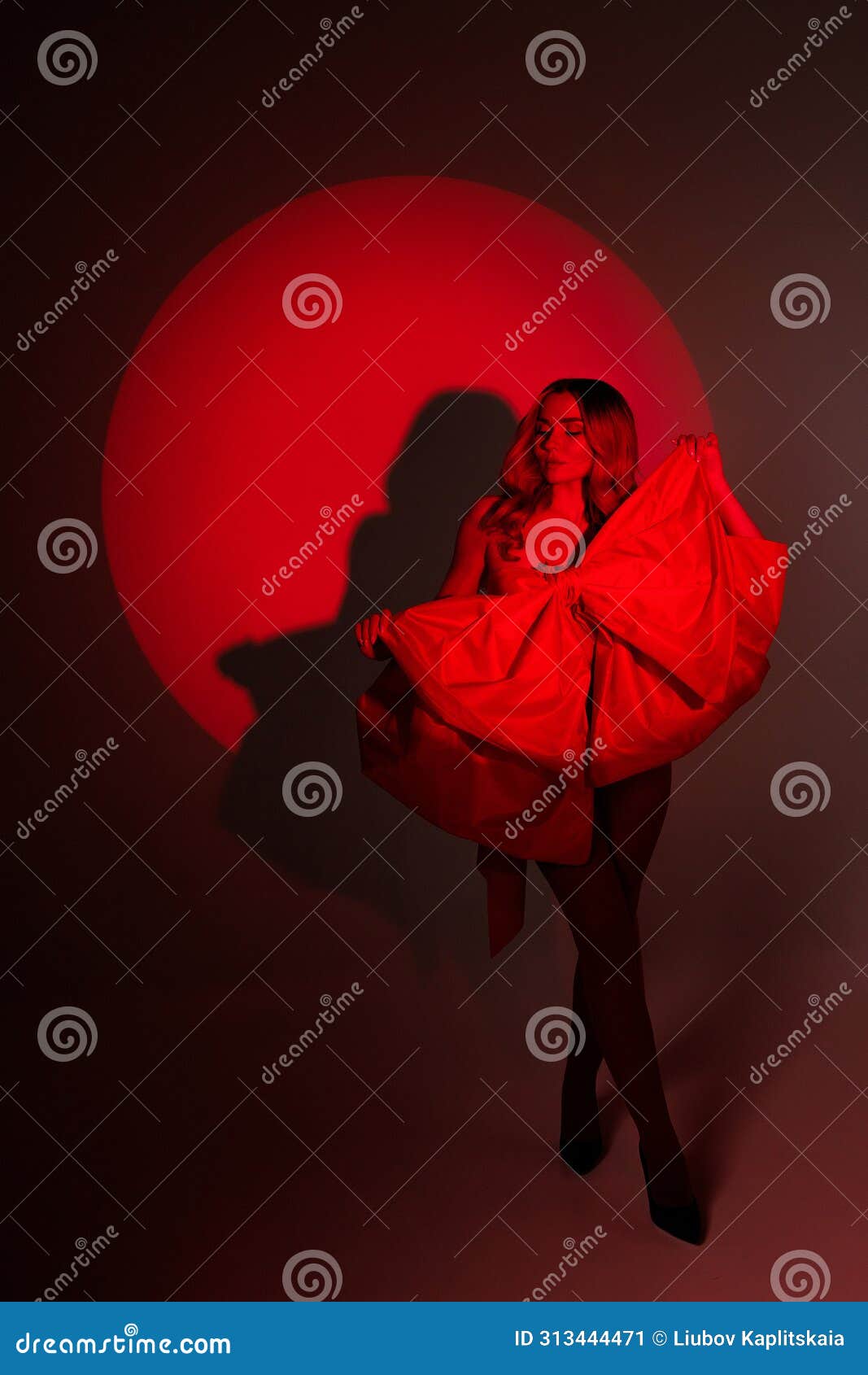 Model in Red on the Background of a Red Spotlight Stock Image - Image ...