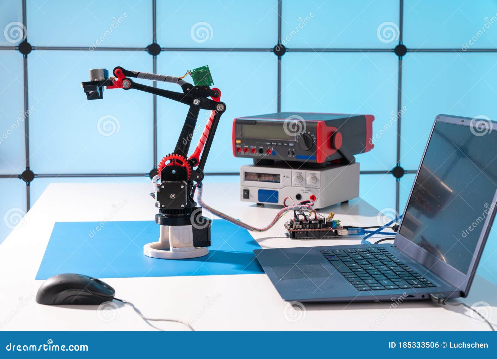 Model of a Robot and a Laptop on a Table in a Design Office Stock Photo ...