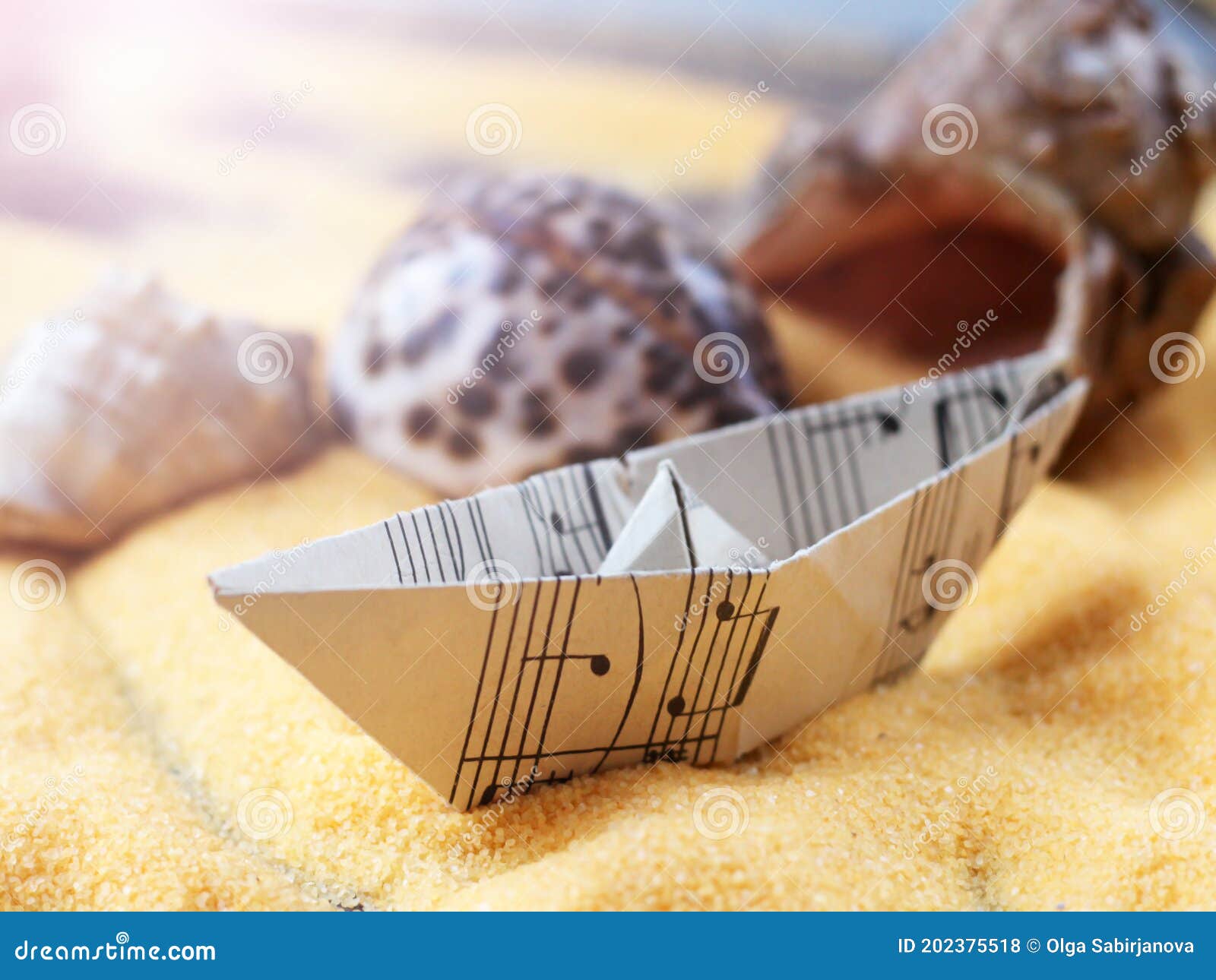 Model of a Ship Made of Paper Musical Notes on the Sand Stock Photo ...
