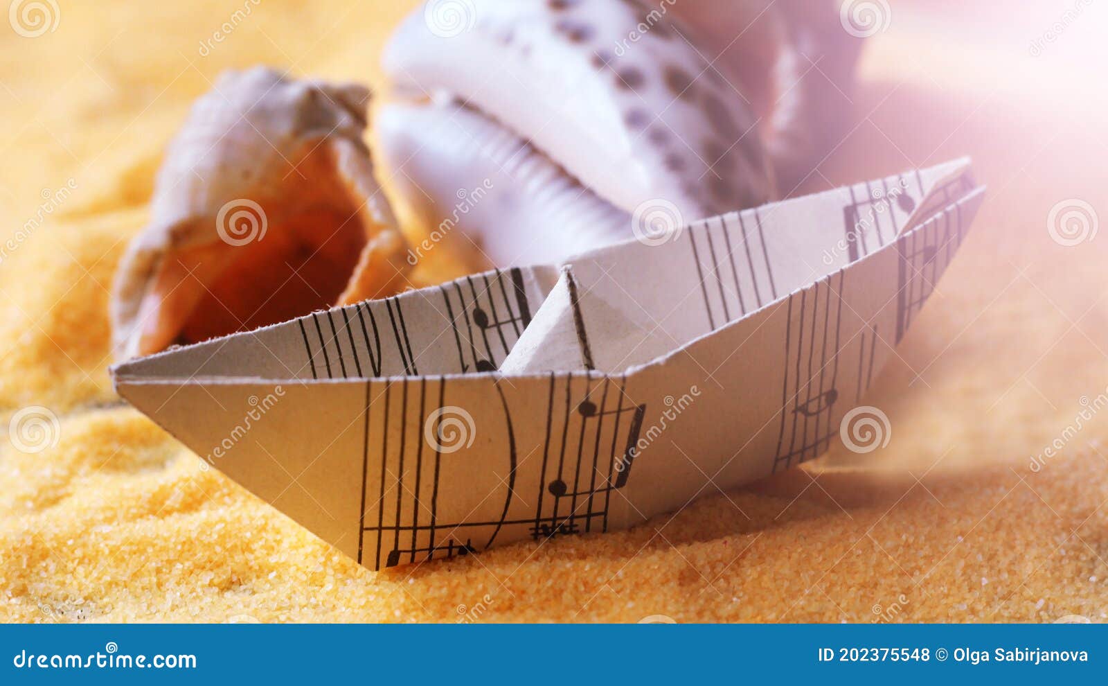 Model of a Ship Made of Paper Musical Notes on the Sand Stock Photo ...