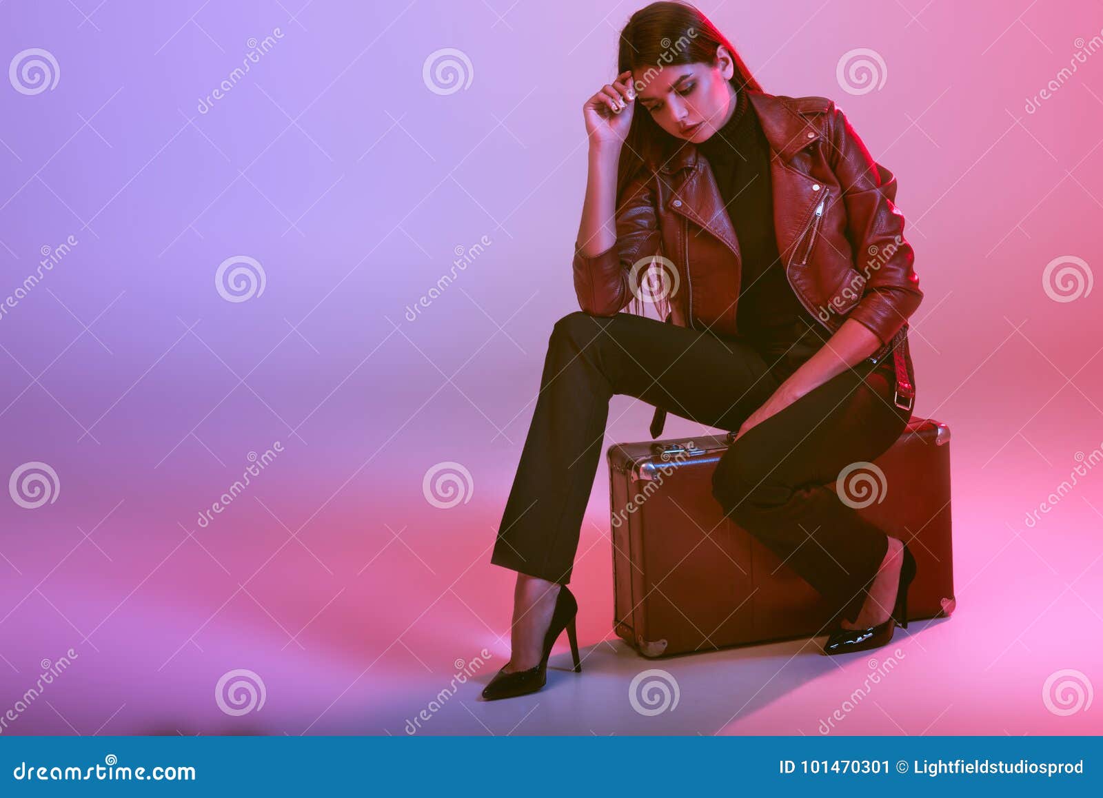 Model sitting on suitcase stock image. Image of attractive - 101470301