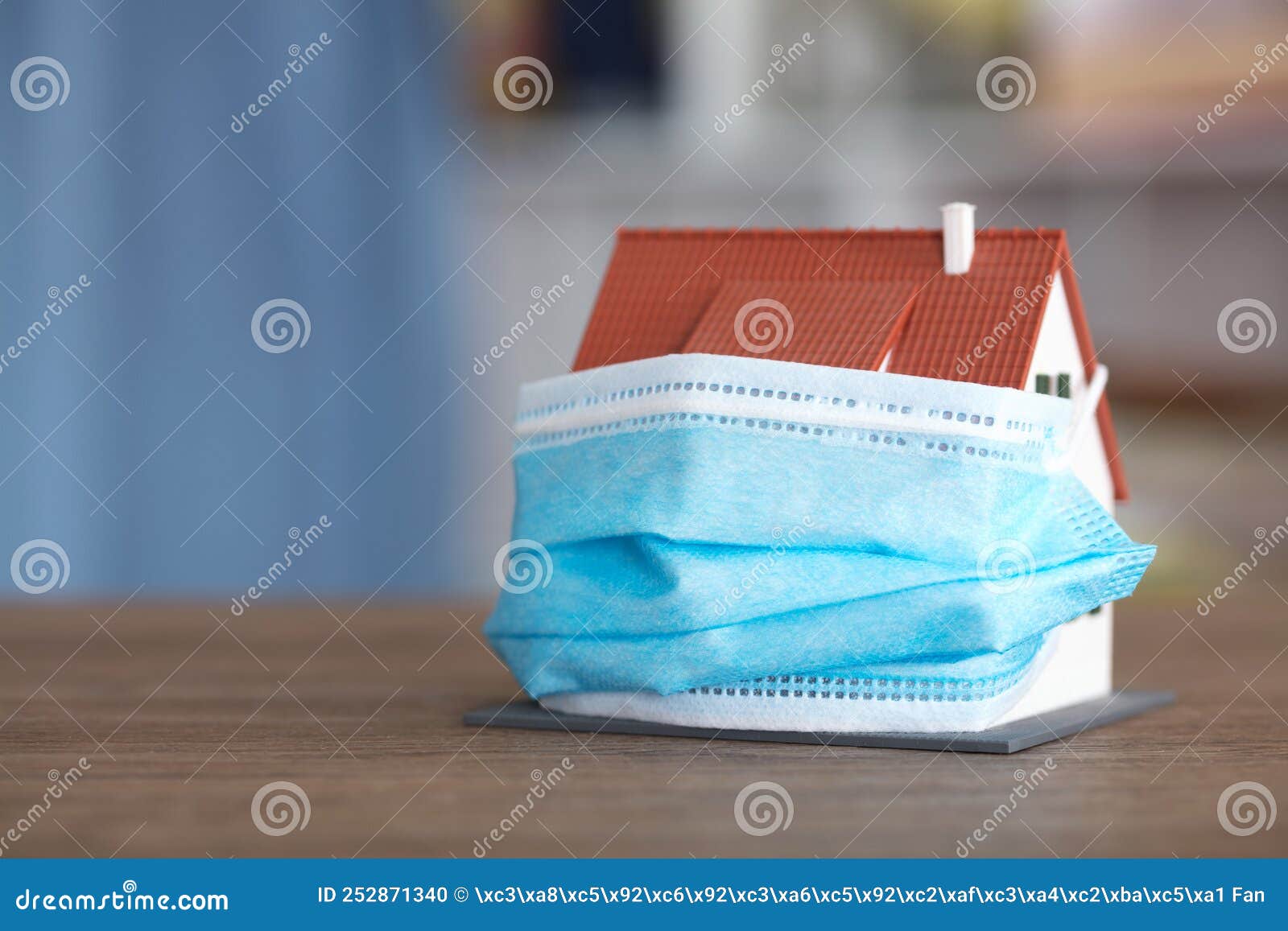 A Model of a Small House with a Mask Stock Photo - Image of small ...