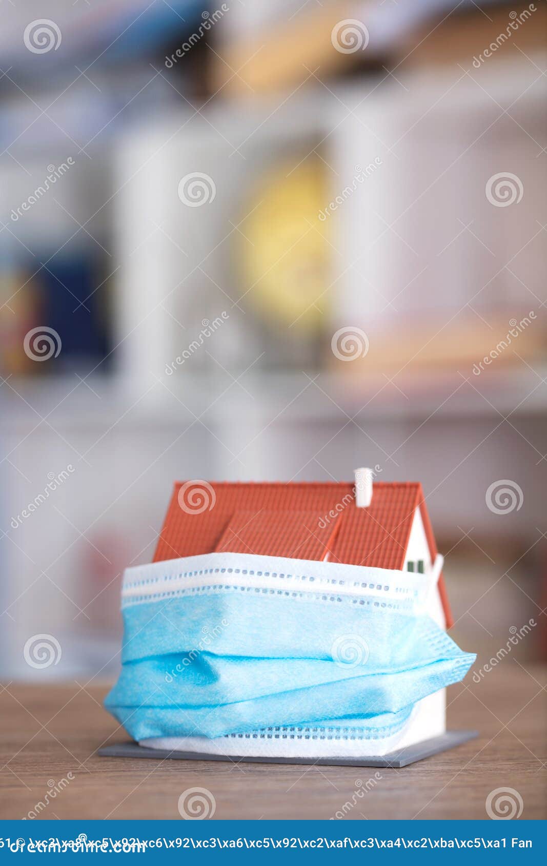 A Model of a Small House with a Mask Stock Image - Image of clock ...