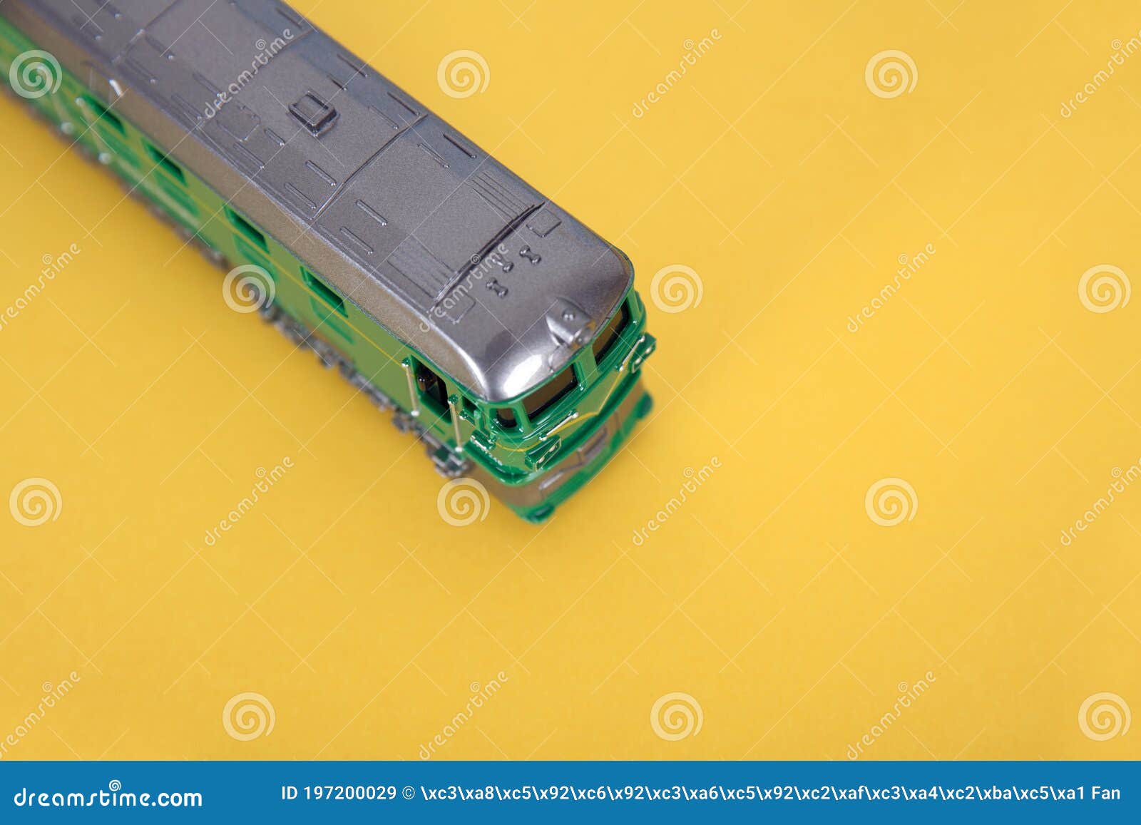 A Model of a Small Train on a Yellow Background Stock Image - Image of ...
