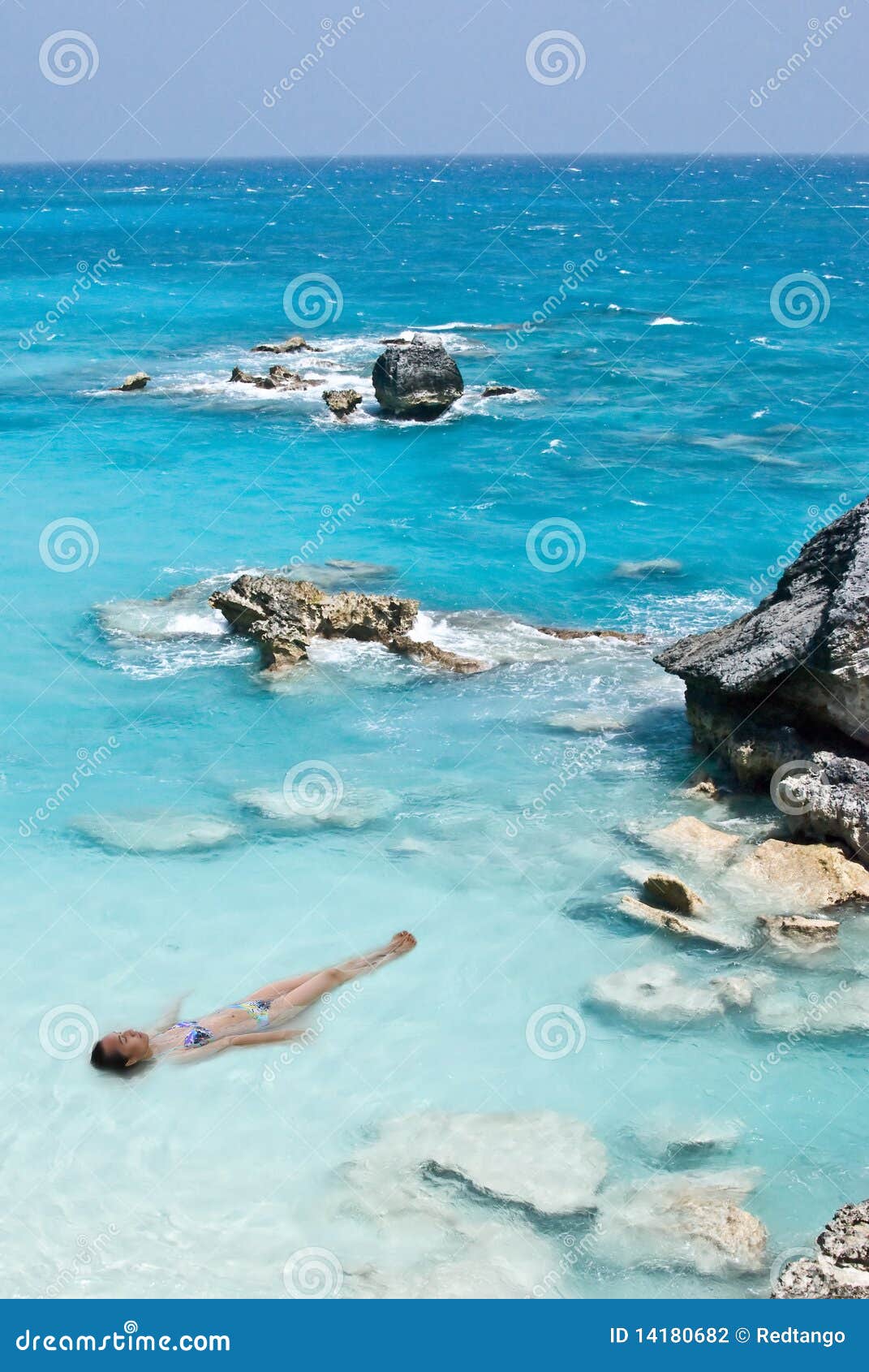 Model sun tanning in ocean stock photo. Image of serene - 14180682