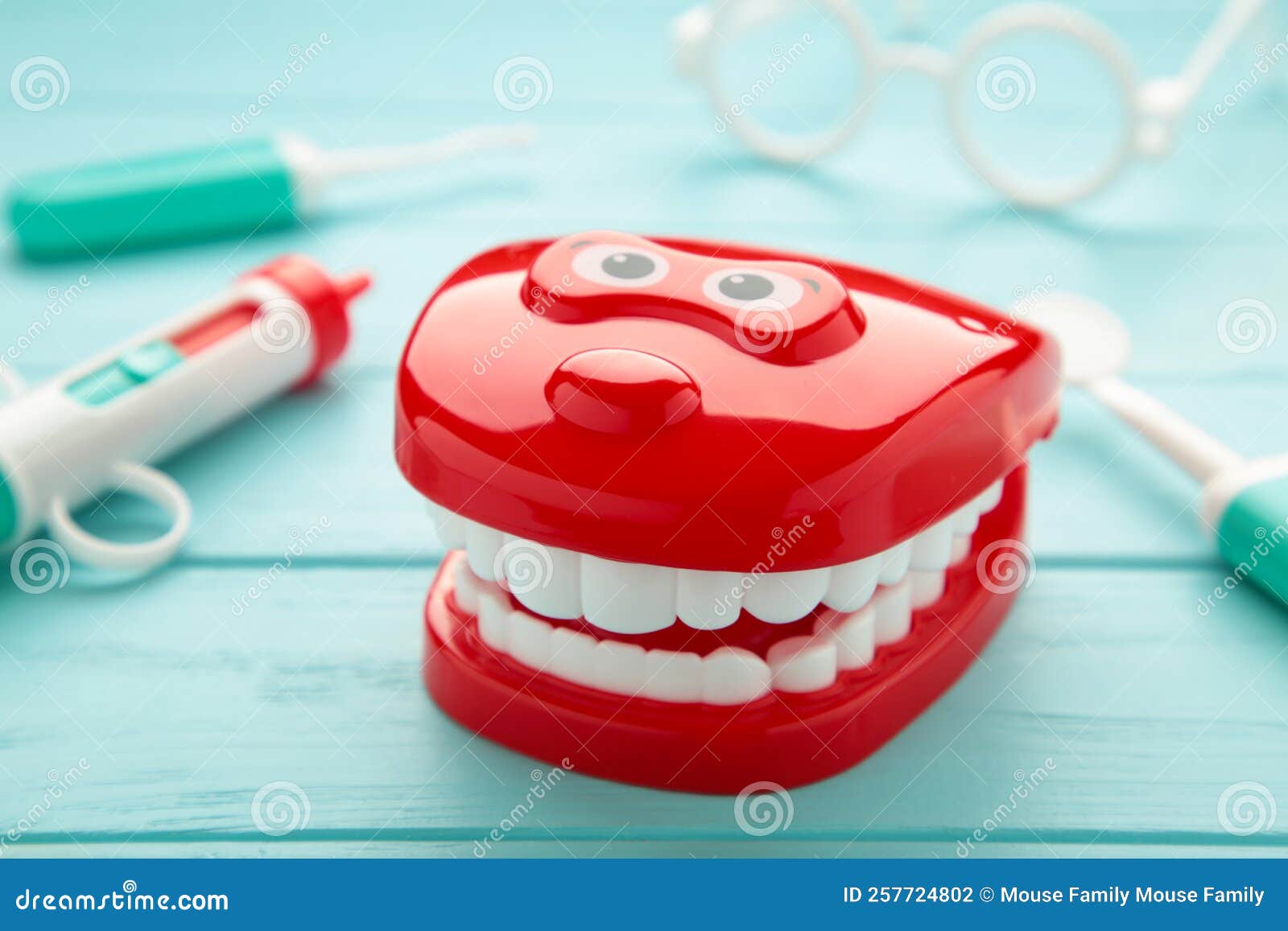 Model Toys Teeth with Dentist Instrument on Blue Background Stock Photo ...