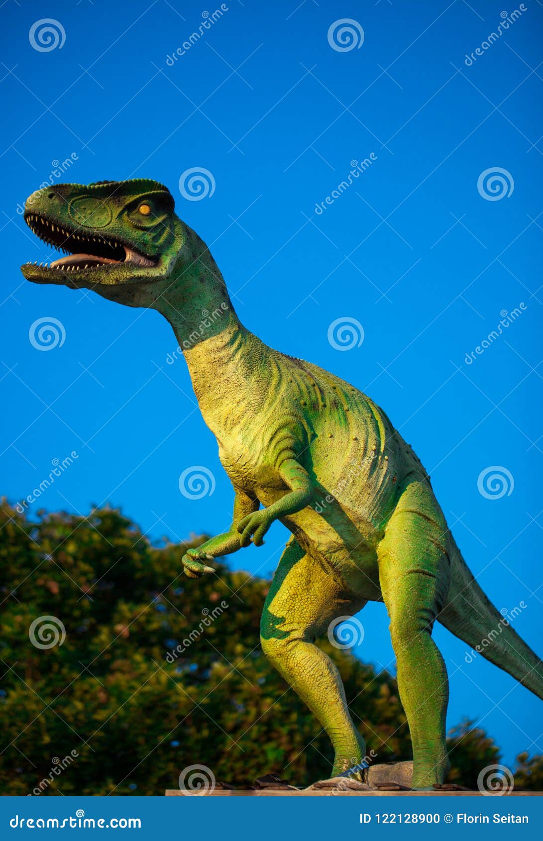 Model of Velociraptor Roaring Against Blue Sky Stock Photo - Image of ...