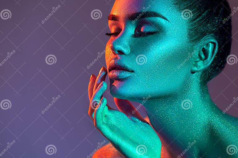 Model Woman In Colorful Bright Sparkles And Neon Lights Posing In