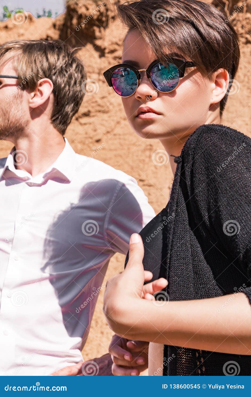 Models Posing on a Sandy Career. Vertical Photo Stock Image - Image of ...