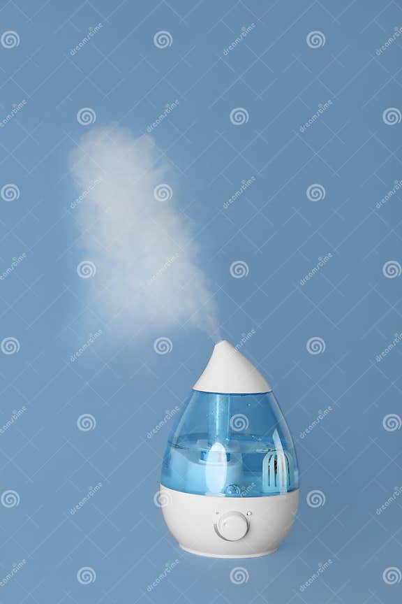 Modern Air Humidifier on Light Blue Background Stock Photo - Image of ...