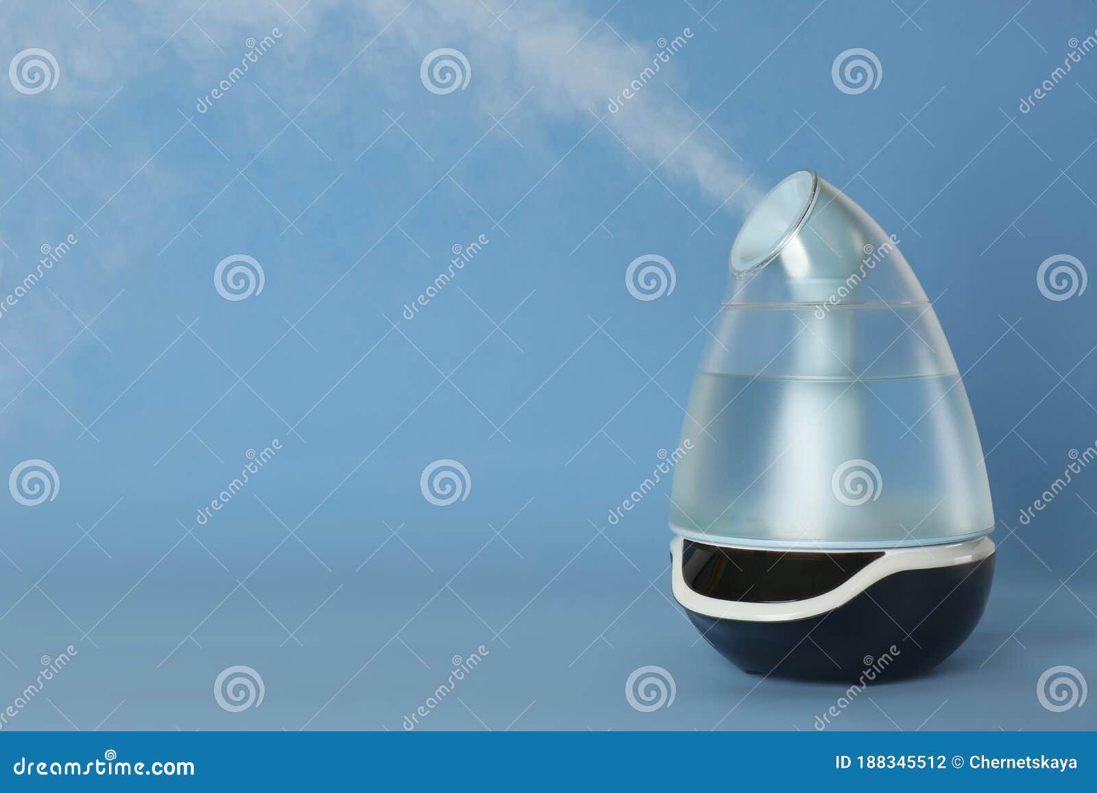 Modern Air Humidifier on Blue Background. Space for Text Stock Photo ...