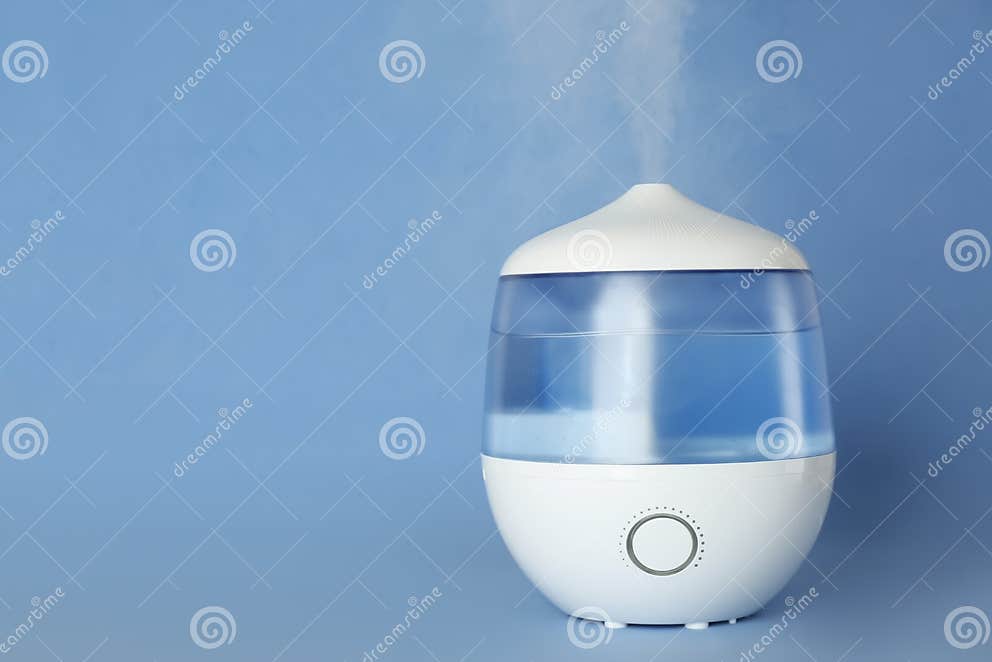 Modern Air Humidifier on Blue Background. Space for Text Stock Image ...
