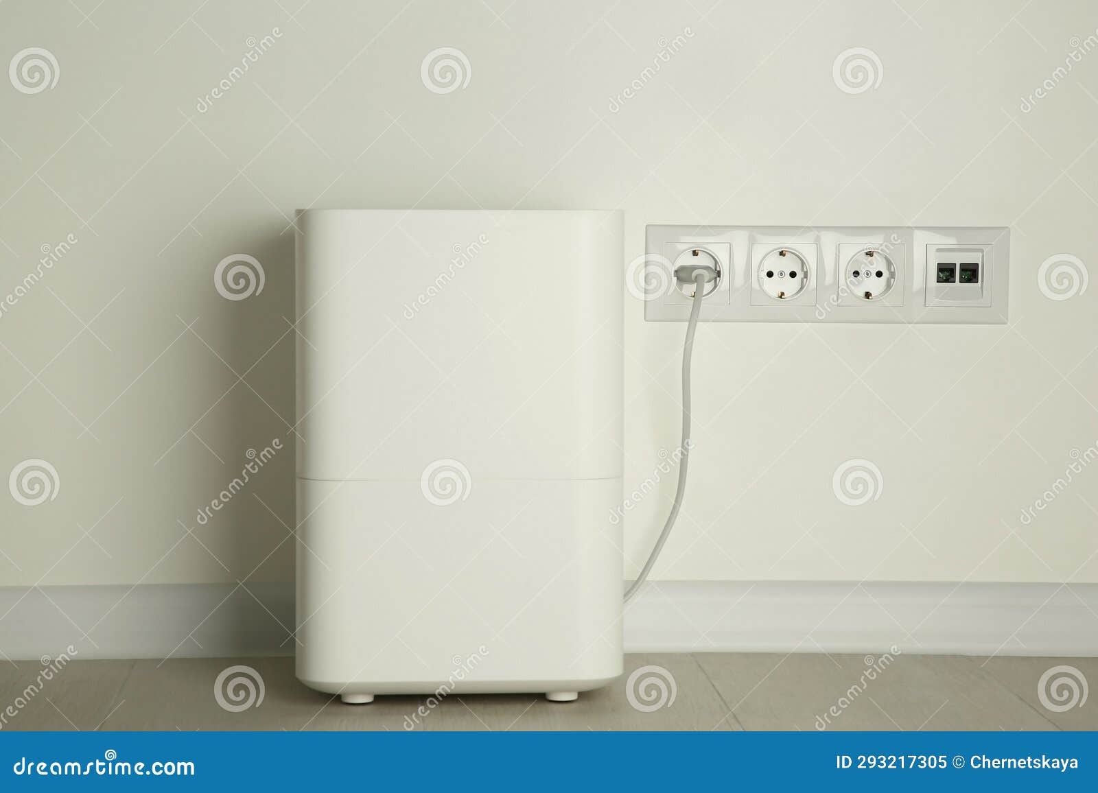 Modern Air Humidifier Plugged into Power Socket on Floor Indoors Stock ...