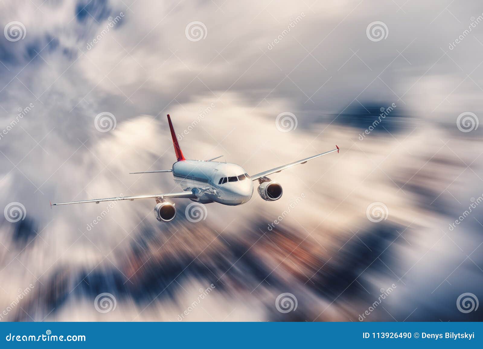 Modern Airplane with Motion Blur Effect is Flying in Clouds Over Stock ...