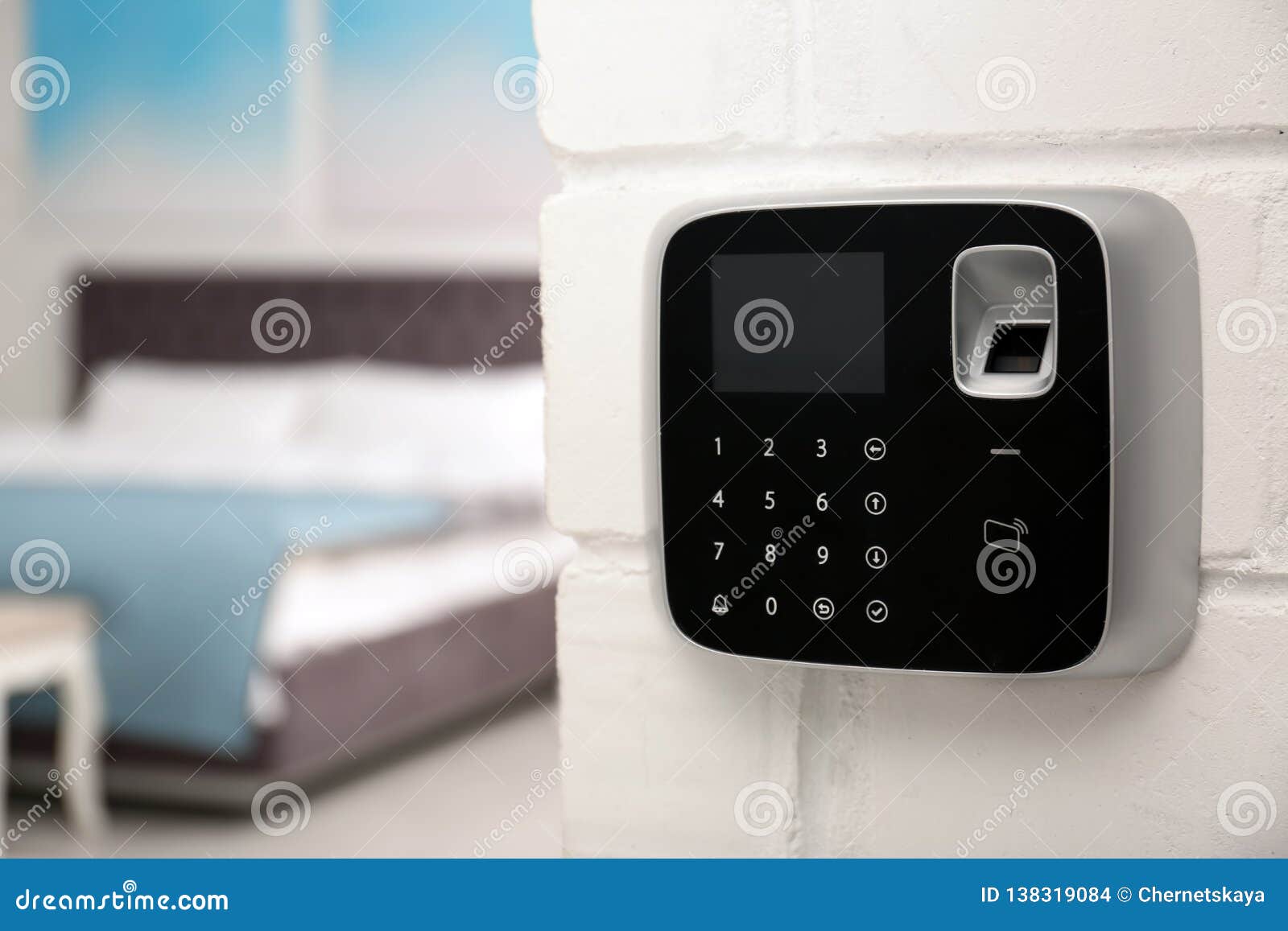 Modern Alarm System with Fingerprint Scanner on Brick Wall in House ...