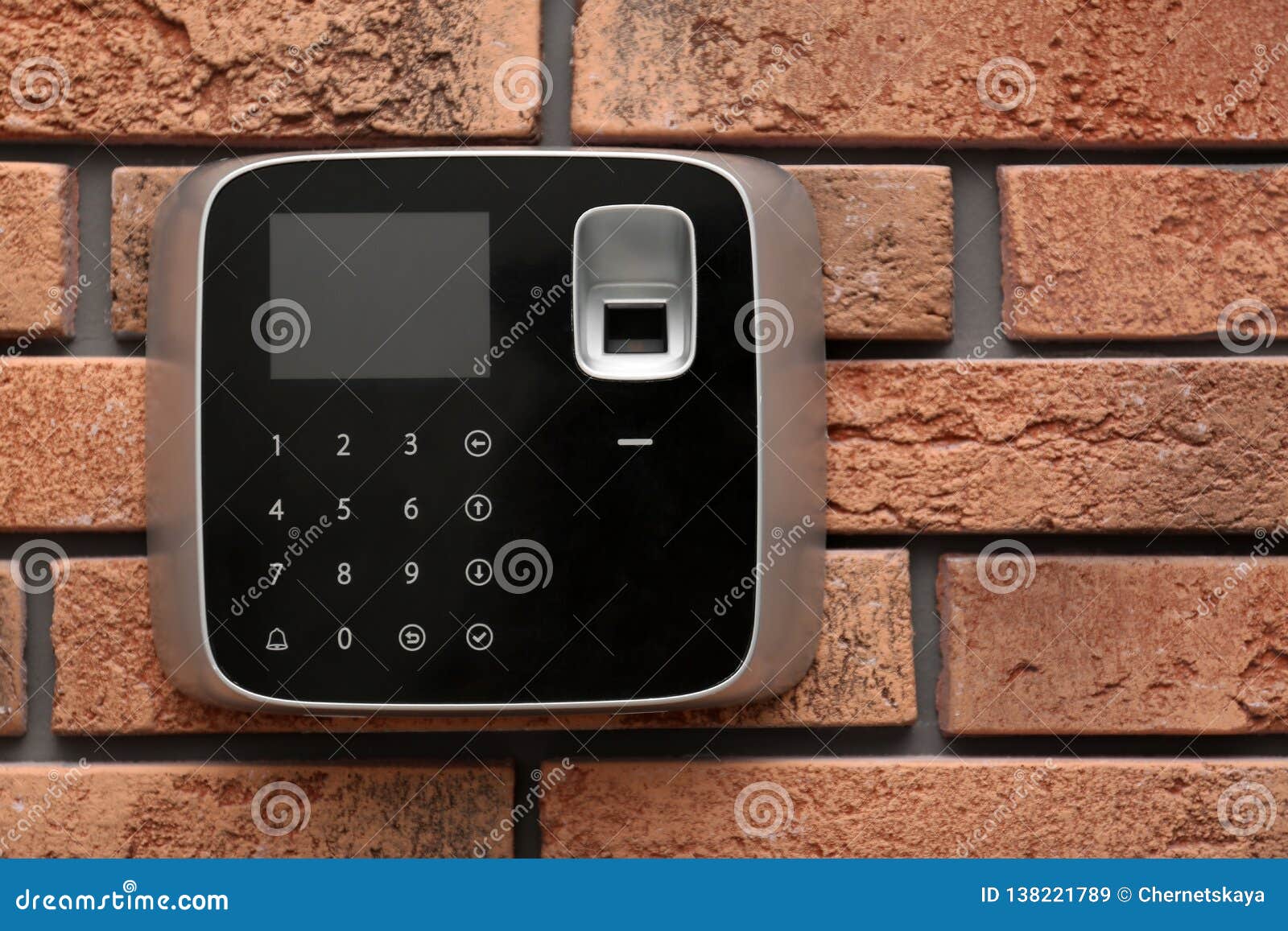 Modern Alarm System with Fingerprint Scanner on Brick Wall. Stock Image ...
