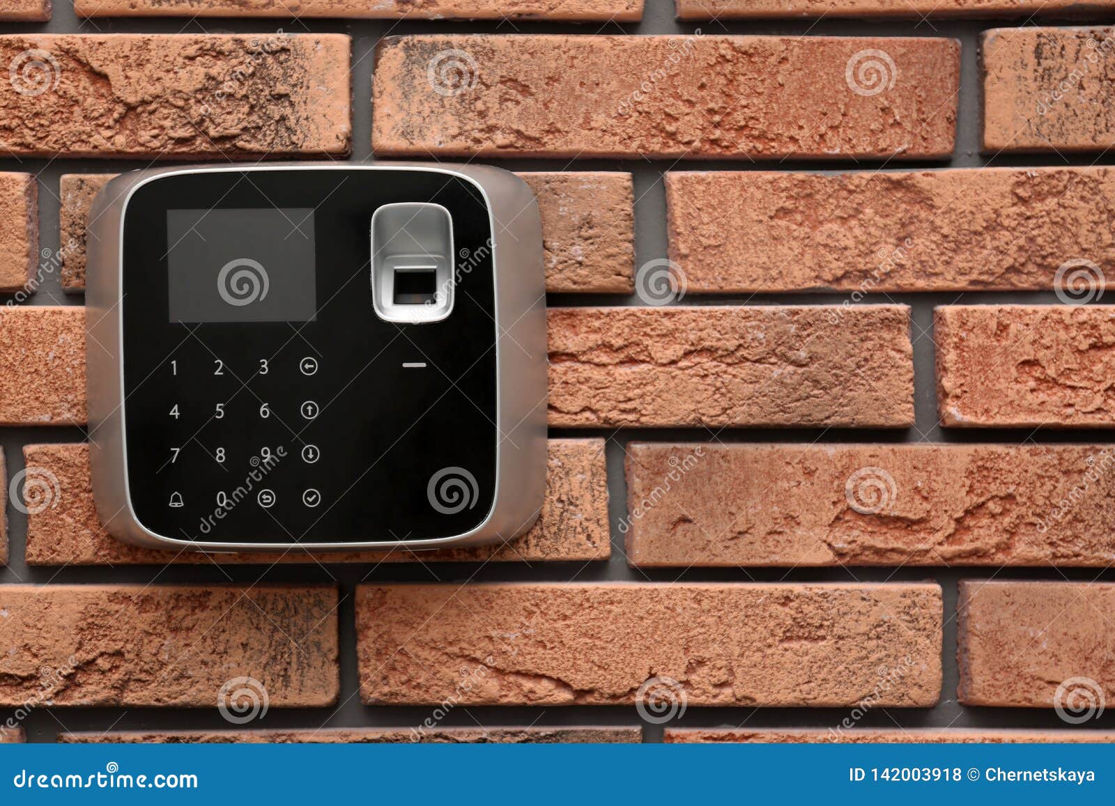 Modern Alarm System with Fingerprint Scanner on Wall. Space for Text ...