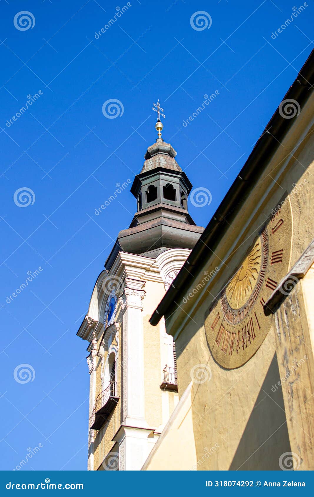 Modern and Ancient Clocks on the Wall and Tower of the Church Stock ...