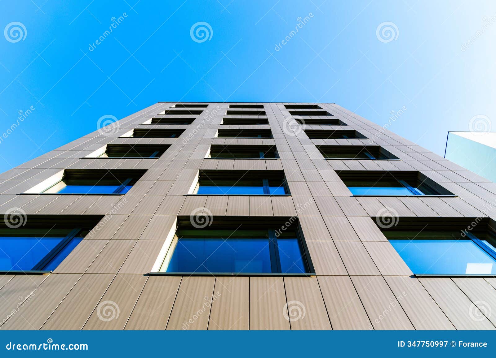 Modern Architectural Facade with Geometric Protrusions and Reflective ...