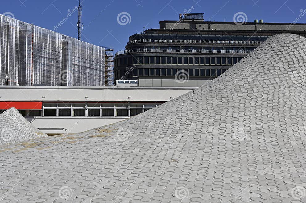A Modern Architectural Scene, Emphasizing a Unique, Undulating Rooftop ...