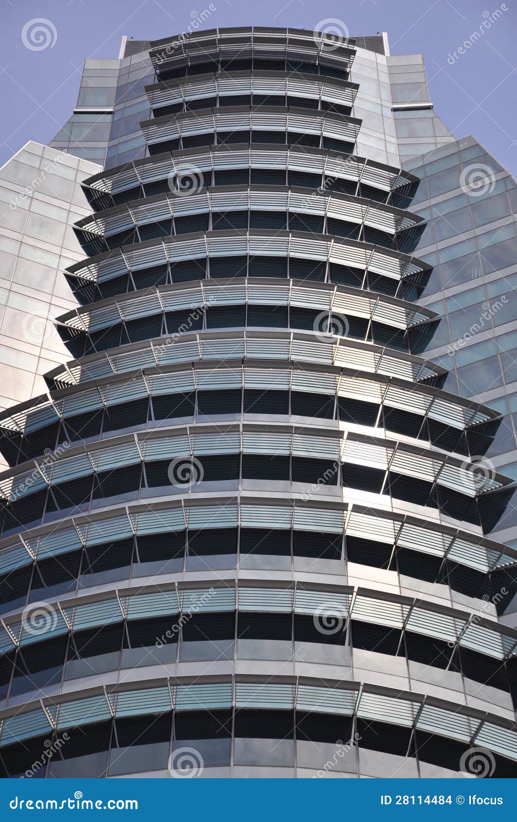 Modern Building Soaring into Blue Sky Stock Photo - Image of building ...