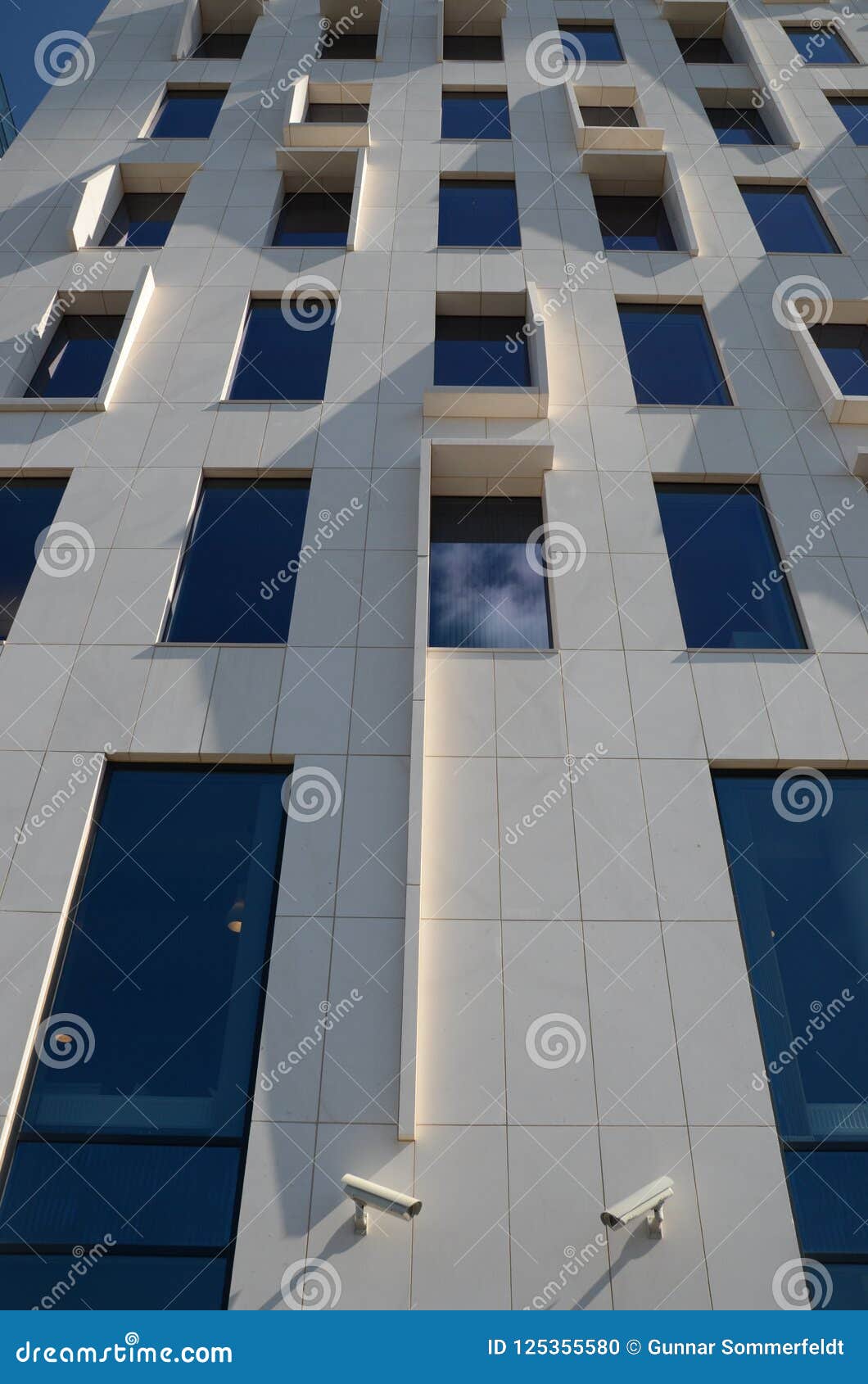 Modern Architecture Office Building with White Panels and Two Security ...