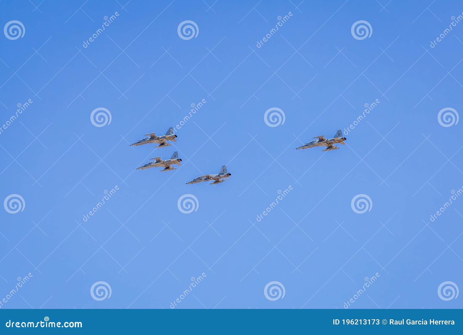 Modern Armed Military Fighter Jets Flys in Formation through the Sky ...