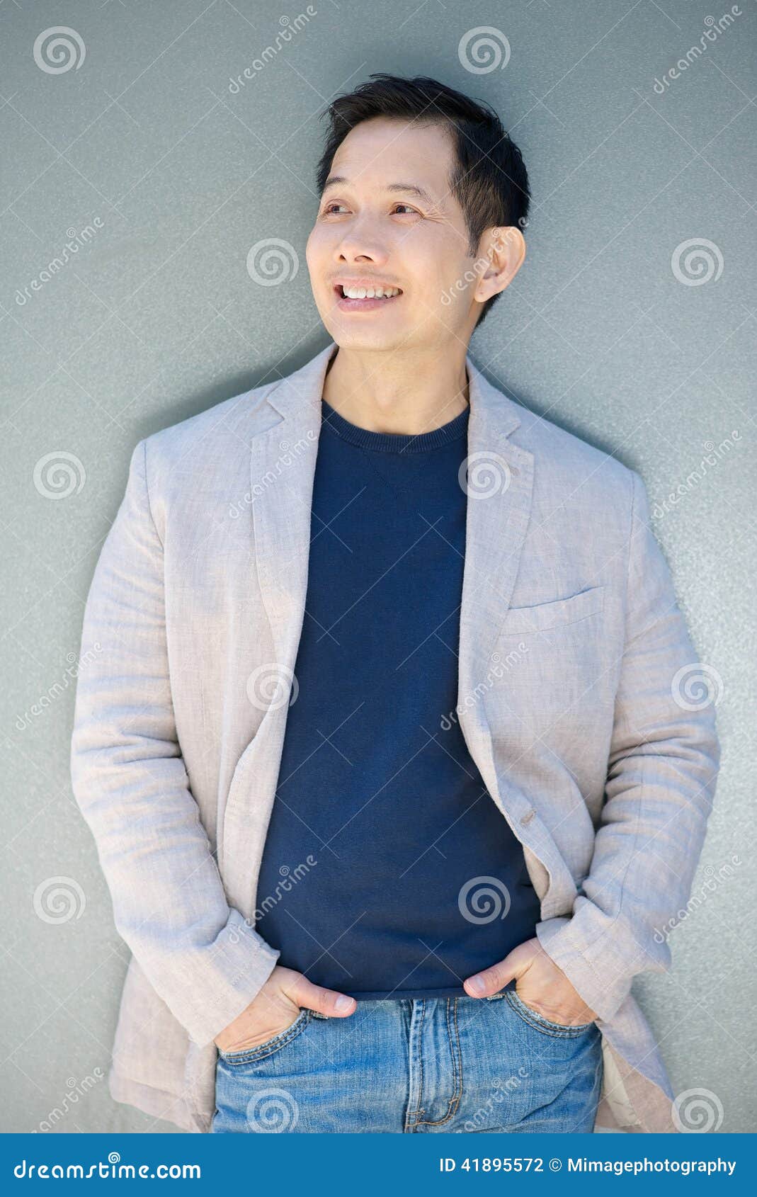 Modern asian man smiling stock photo. Image of face, jeans - 41895572