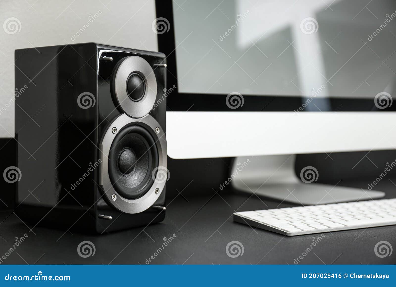 Modern Audio Speaker and Computer on Table Indoors Stock Photo - Image ...