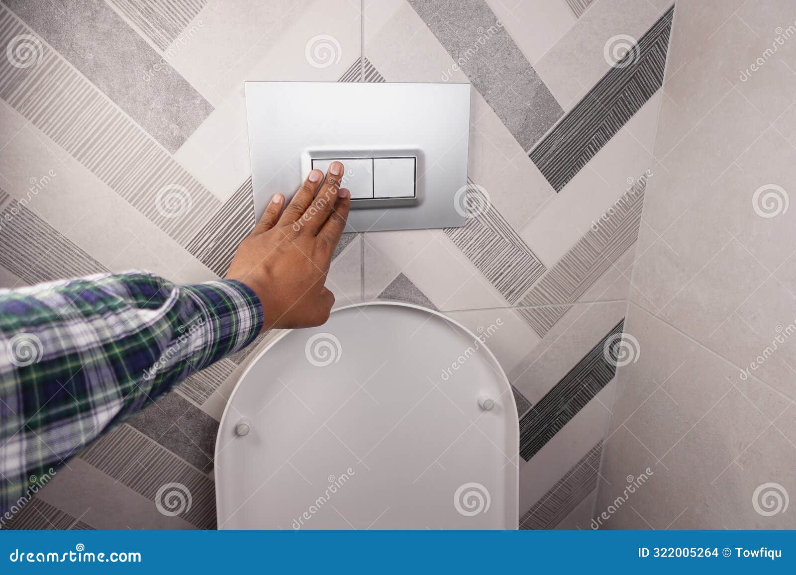 A Modern Bathroom with Flush Plate and Herringbone Tiles for a Stylish ...