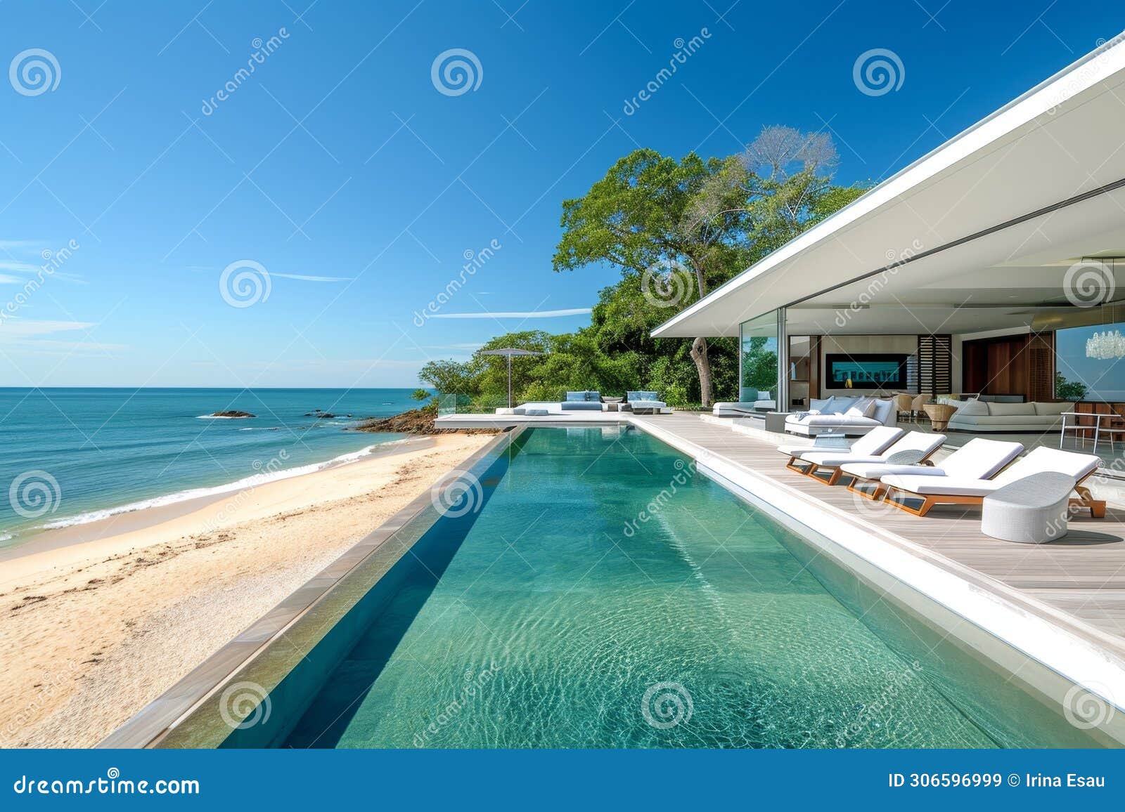 Modern Beach House with Infinity Pool Against Ocean Backdrop. Stock ...