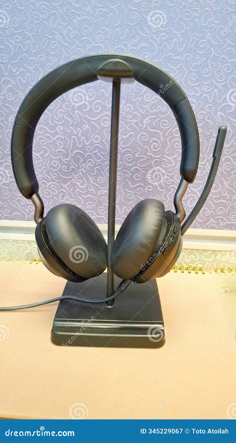 A Modern Black Headset with Microphone, Placed on a Special Stand and ...