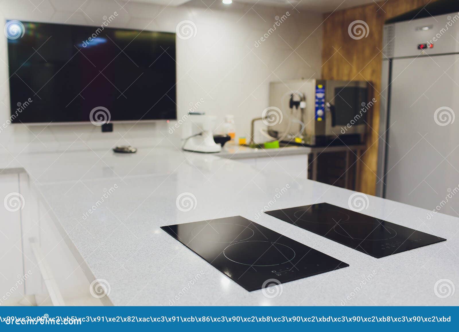 Modern Black Induction Cooker on White Countertop. Kitchen with Island ...