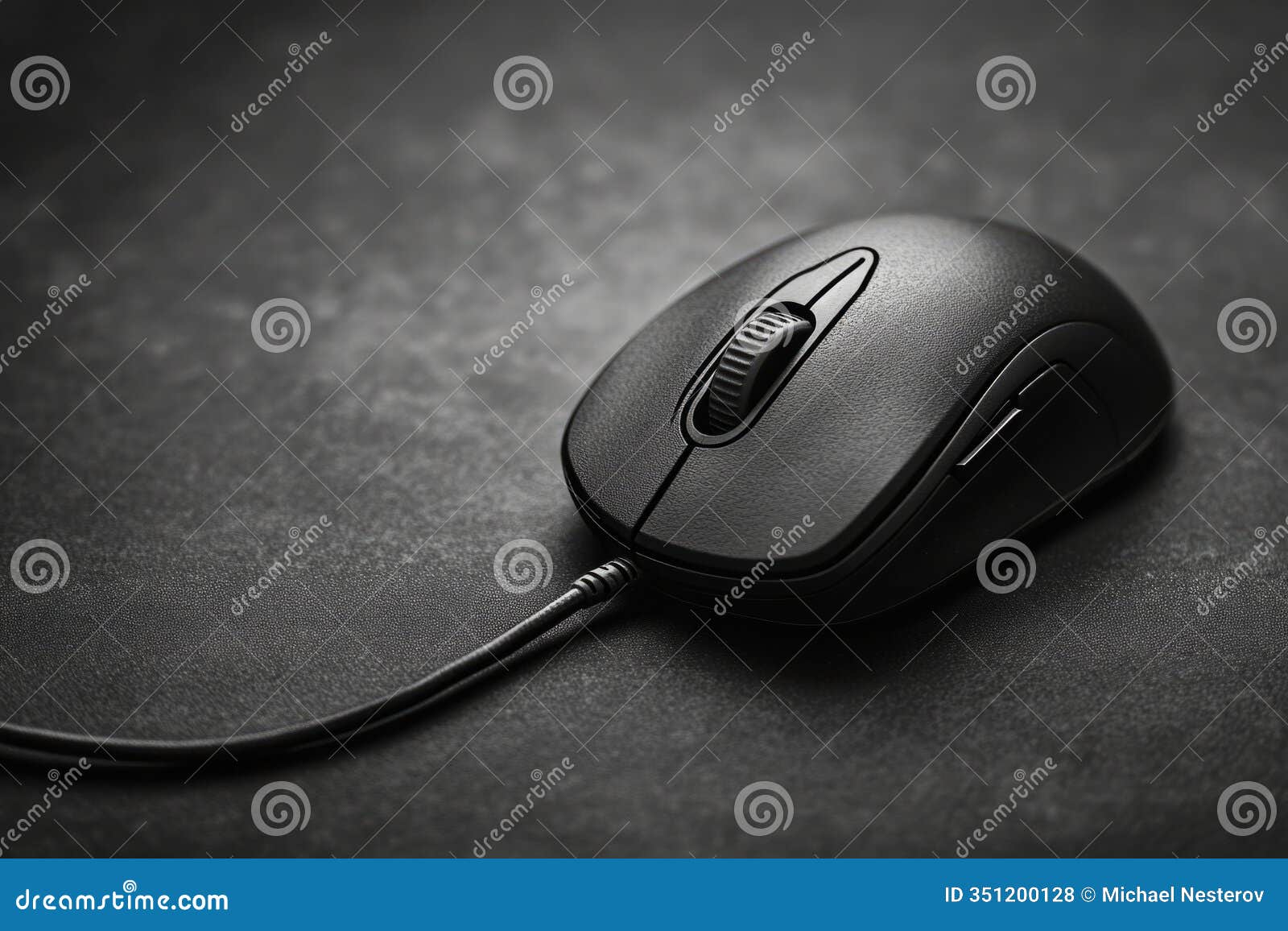 Modern Black Wired Computer Mouse Resting on a Dark Stone Desk ...