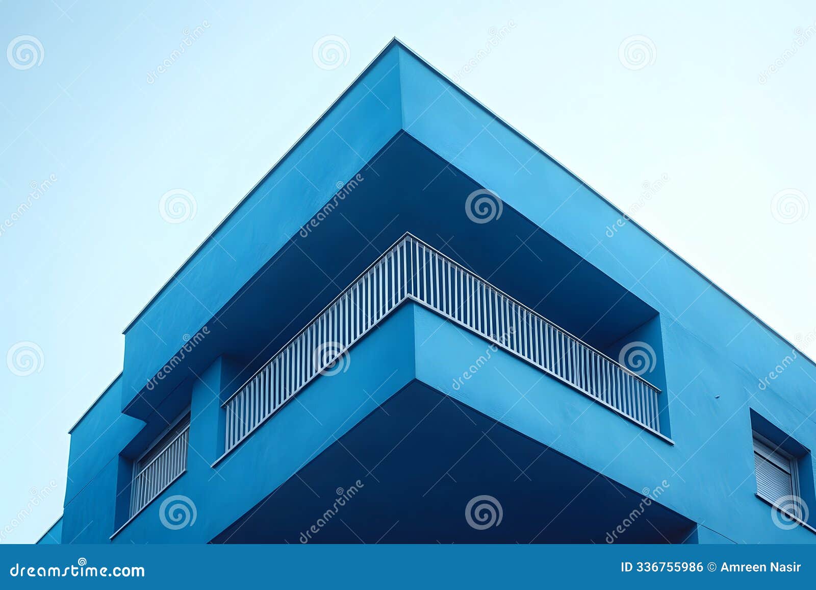 Modern Blue Building Facade with Geometric Design and Balcony ...
