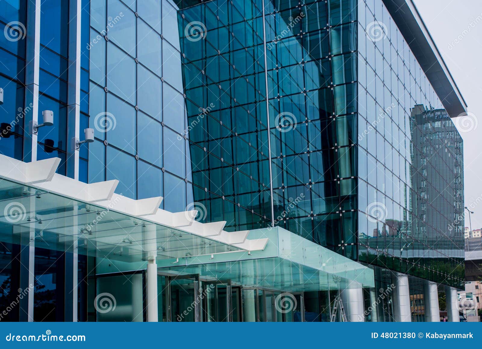 Modern Blue Glass Building Exterior Stock Photo - Image of knot, bank ...