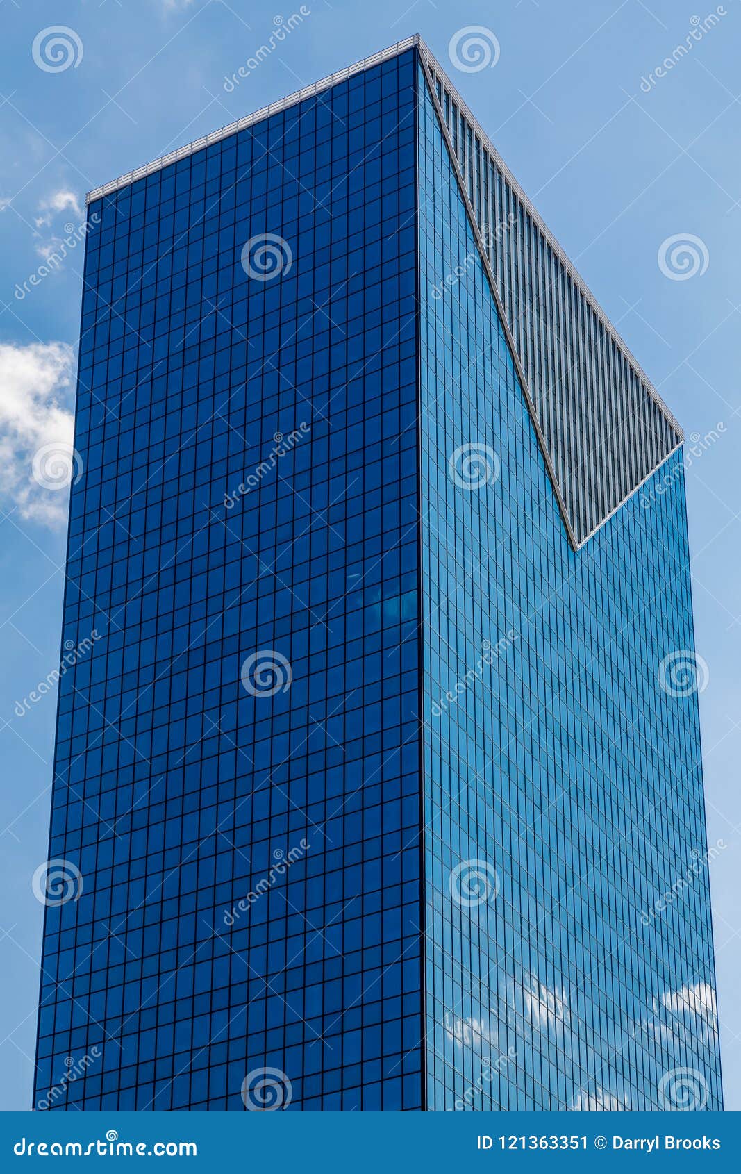Clouds Reflected in Blue Tower Wtih Triangle Design Stock Image - Image ...