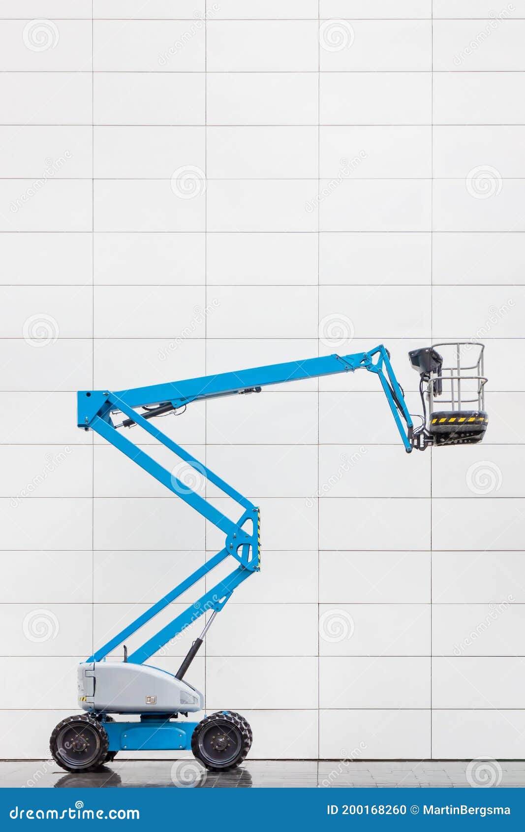 Modern Blue Hydraulic Lift Platform in Front of a White Tiled Office ...