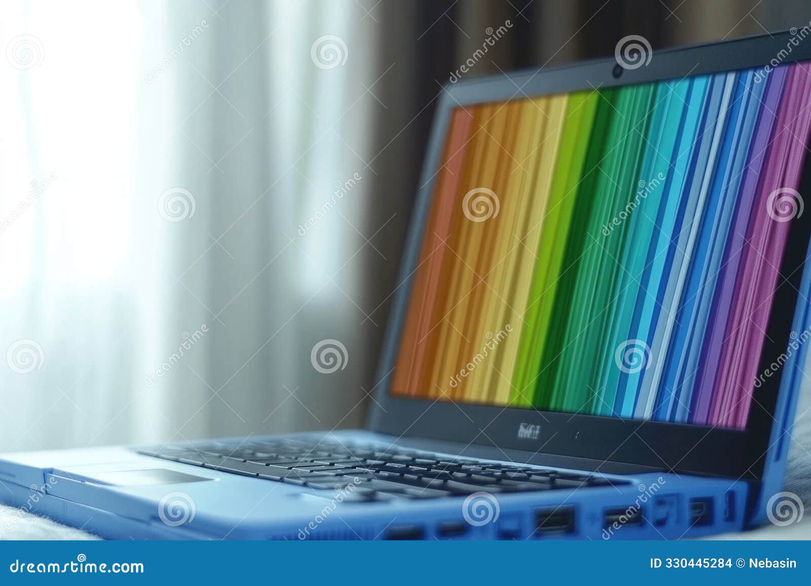 Modern Blue Laptop with Colorful Display on White Surface, Focus on ...