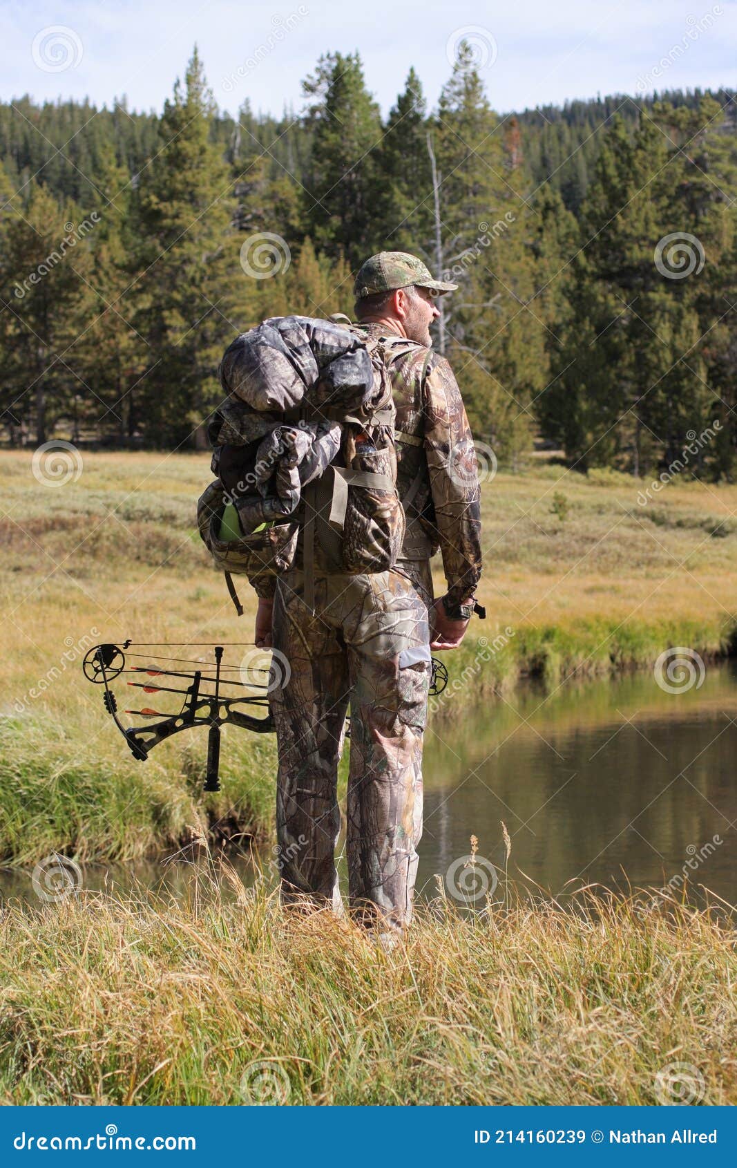Modern Bow Hunter Standing by a Stream Stock Image - Image of ...