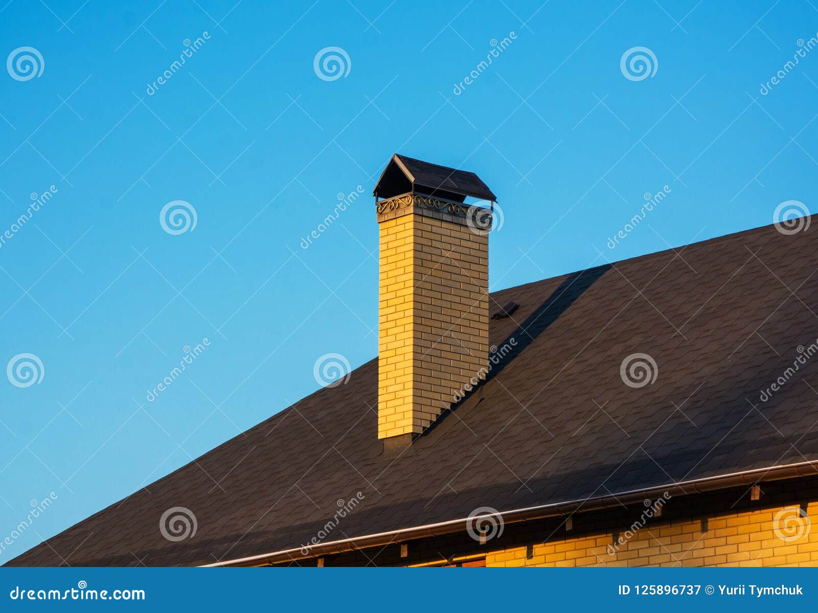 Modern Brick Chimney with Beautiful Forge. Clear Blue Sky Background ...